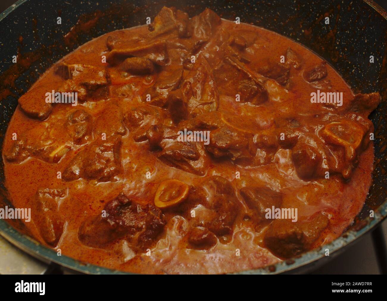Mutton curry cooking Stock Photo - Alamy