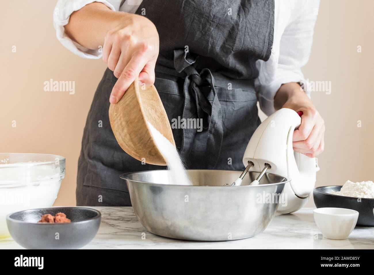 Woman making cake in her kitchen. Step by step recipe of chocolate ...