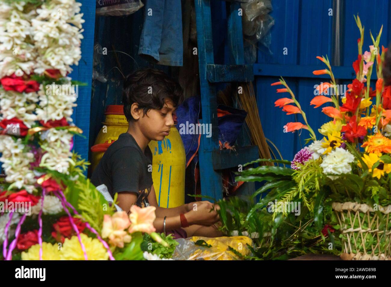 Indian young boy seller on Flower market at Mallick Ghat in Kolkata ...