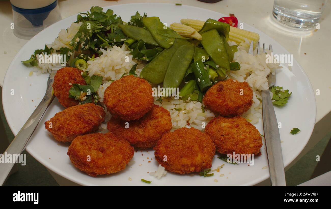 Nuggets, rice and veggies Stock Photo - Alamy