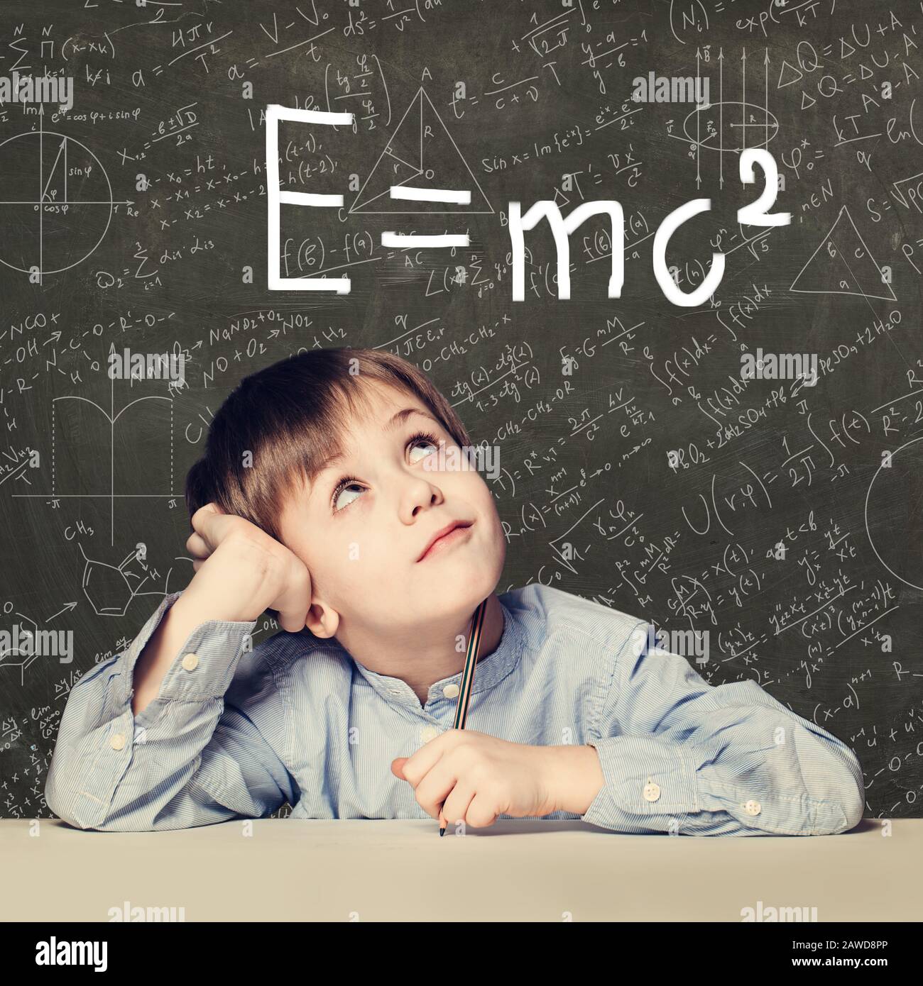 Student little boy and science background. Kid with science formulas ...