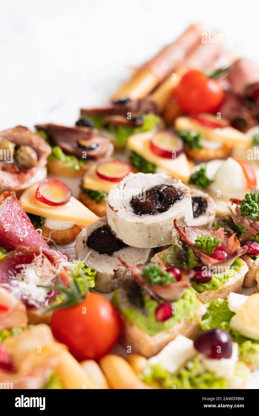 Tasty canapes and appetizers catering service buffet meal concept Stock ...