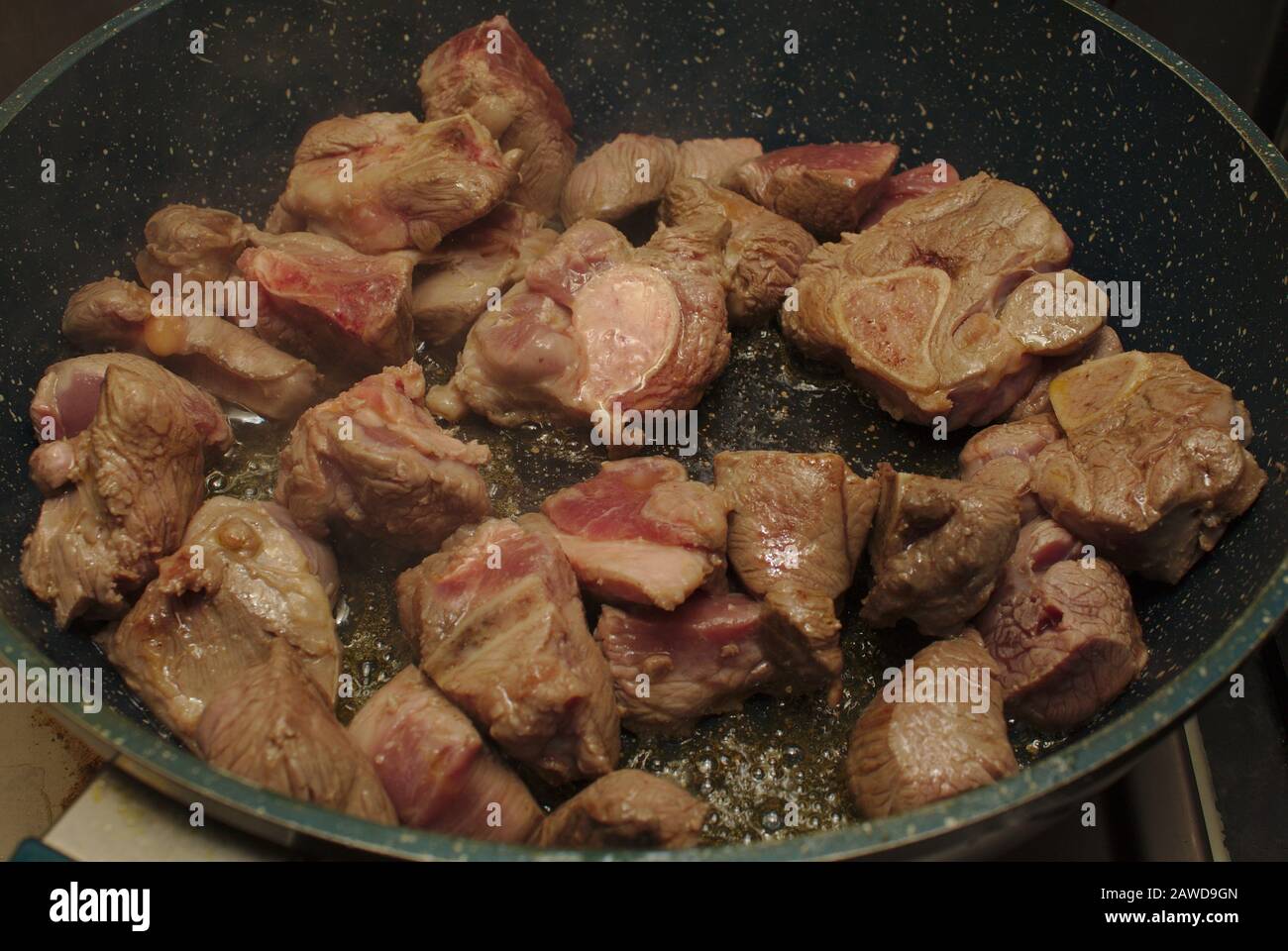 Mutton curry cooking Stock Photo - Alamy