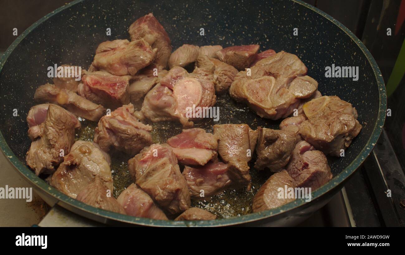 Mutton curry cooking Stock Photo - Alamy