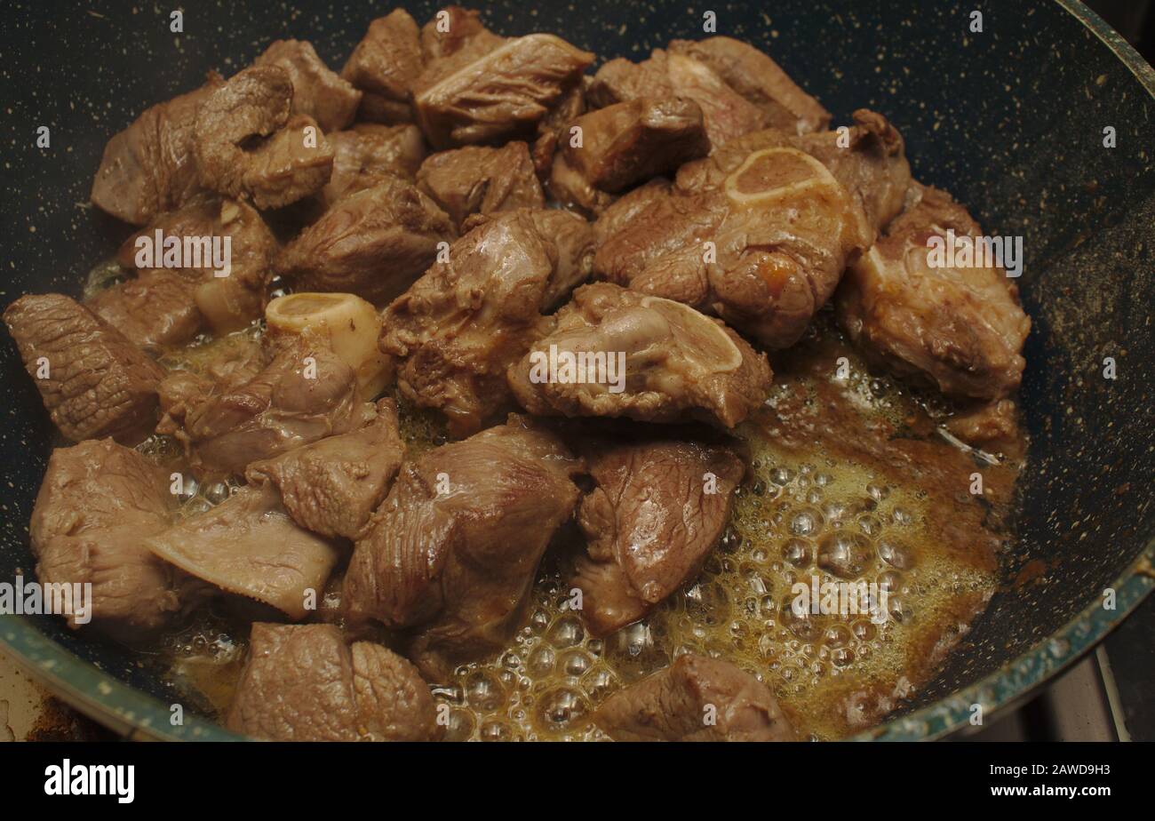 Mutton curry cooking Stock Photo - Alamy