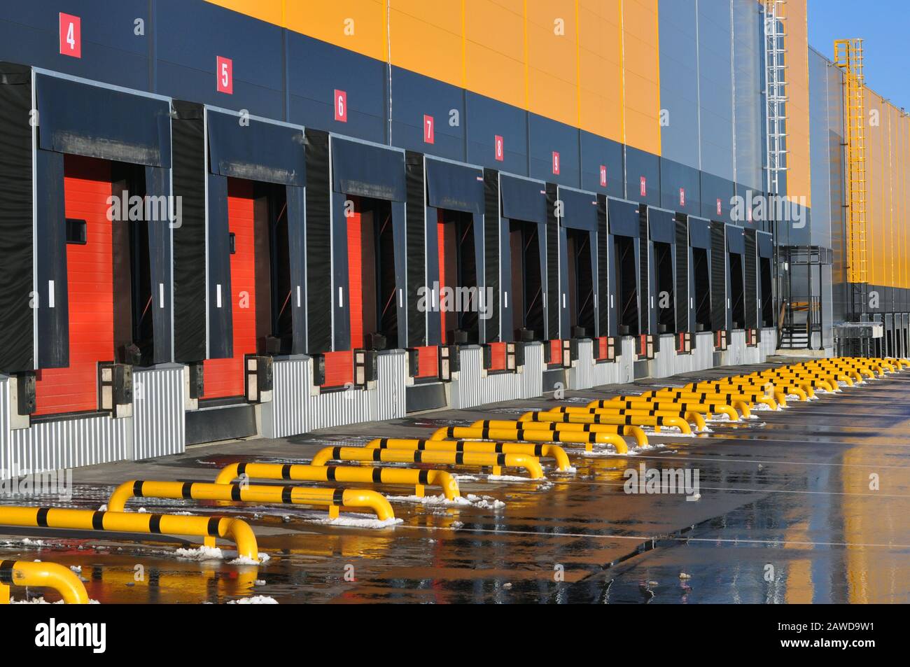 Front view of loading docks of a modern logistics center. Logistics ...
