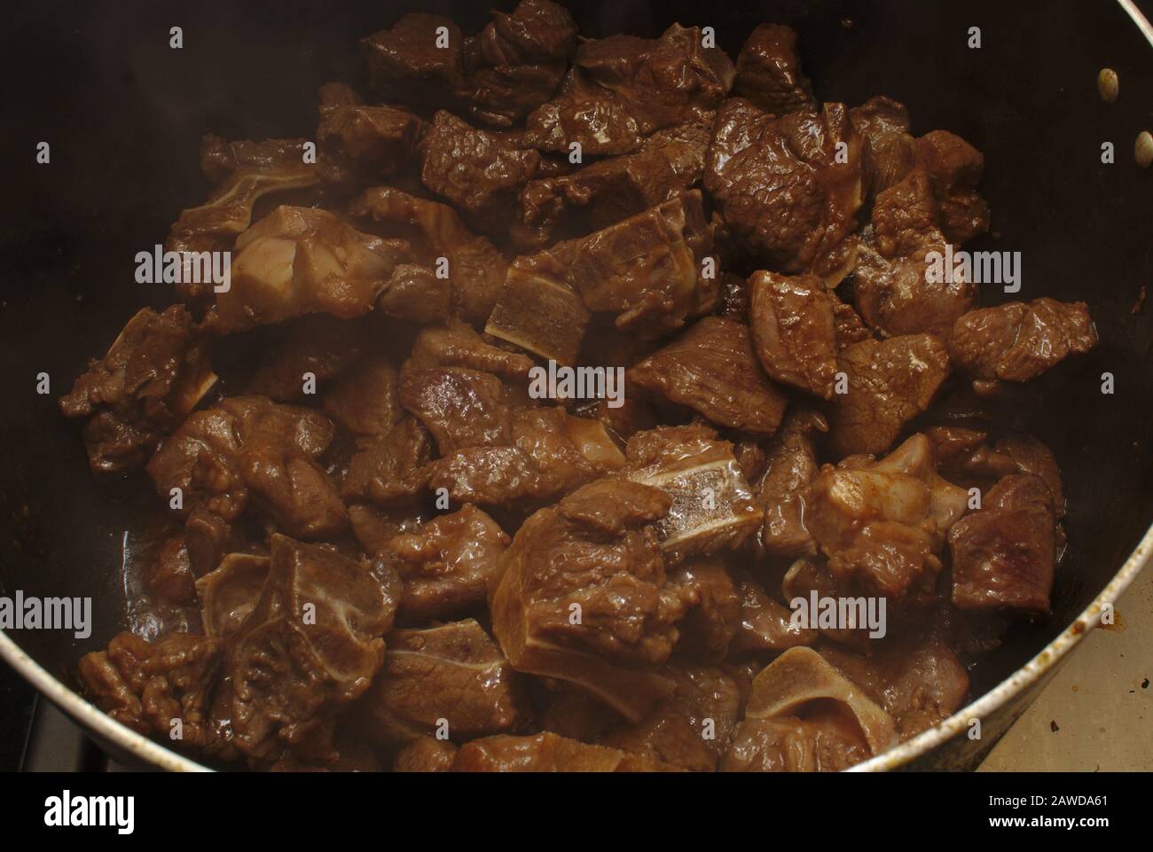 Mutton curry cooking Stock Photo - Alamy