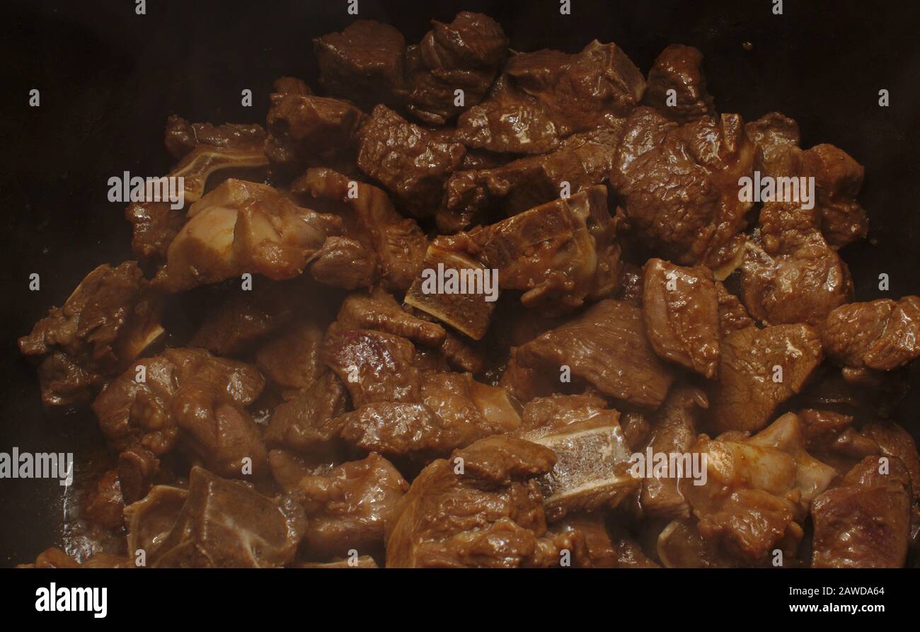 Mutton curry cooking Stock Photo - Alamy