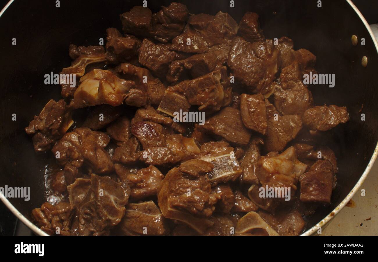 Mutton curry cooking Stock Photo - Alamy