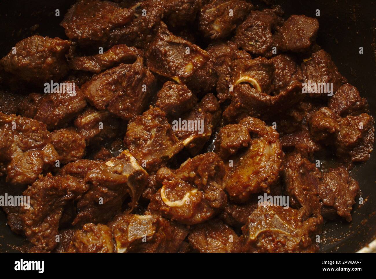 Mutton curry cooking Stock Photo - Alamy