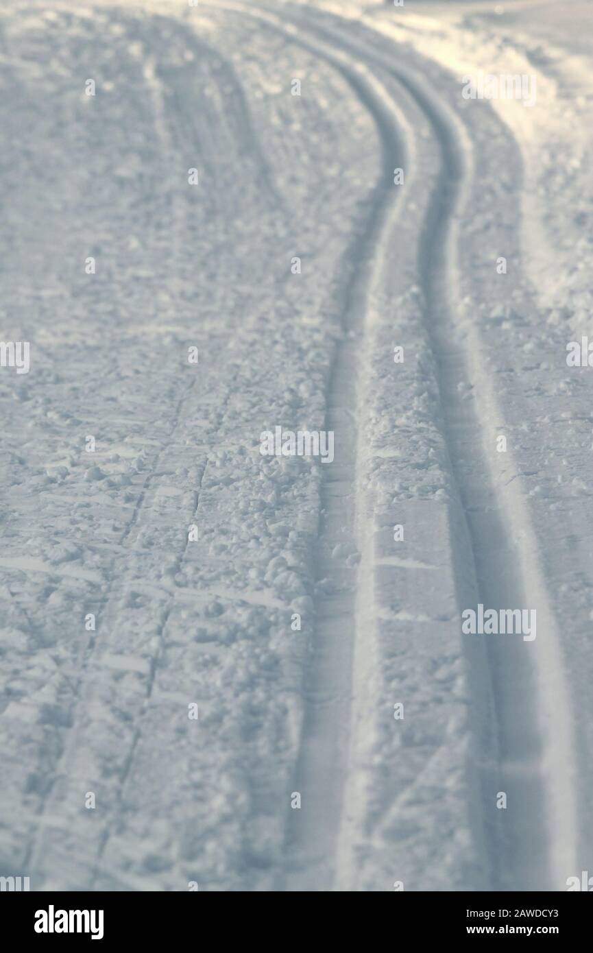 Ski track in snow. Hilly snowy surface. Active winter holiday concept ...