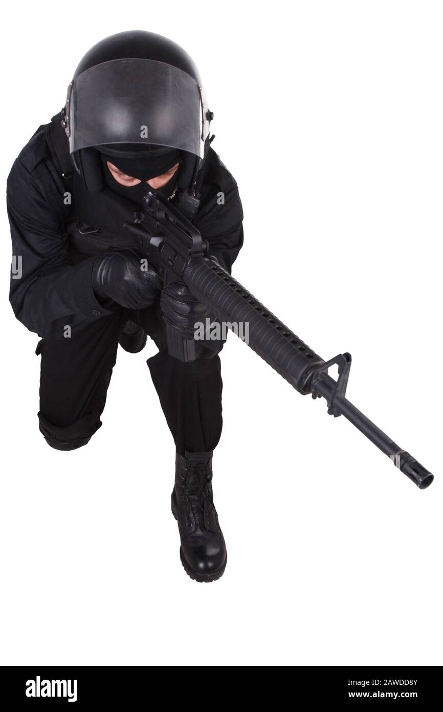 Riot police officer in black uniform with assault rifle isolated on ...
