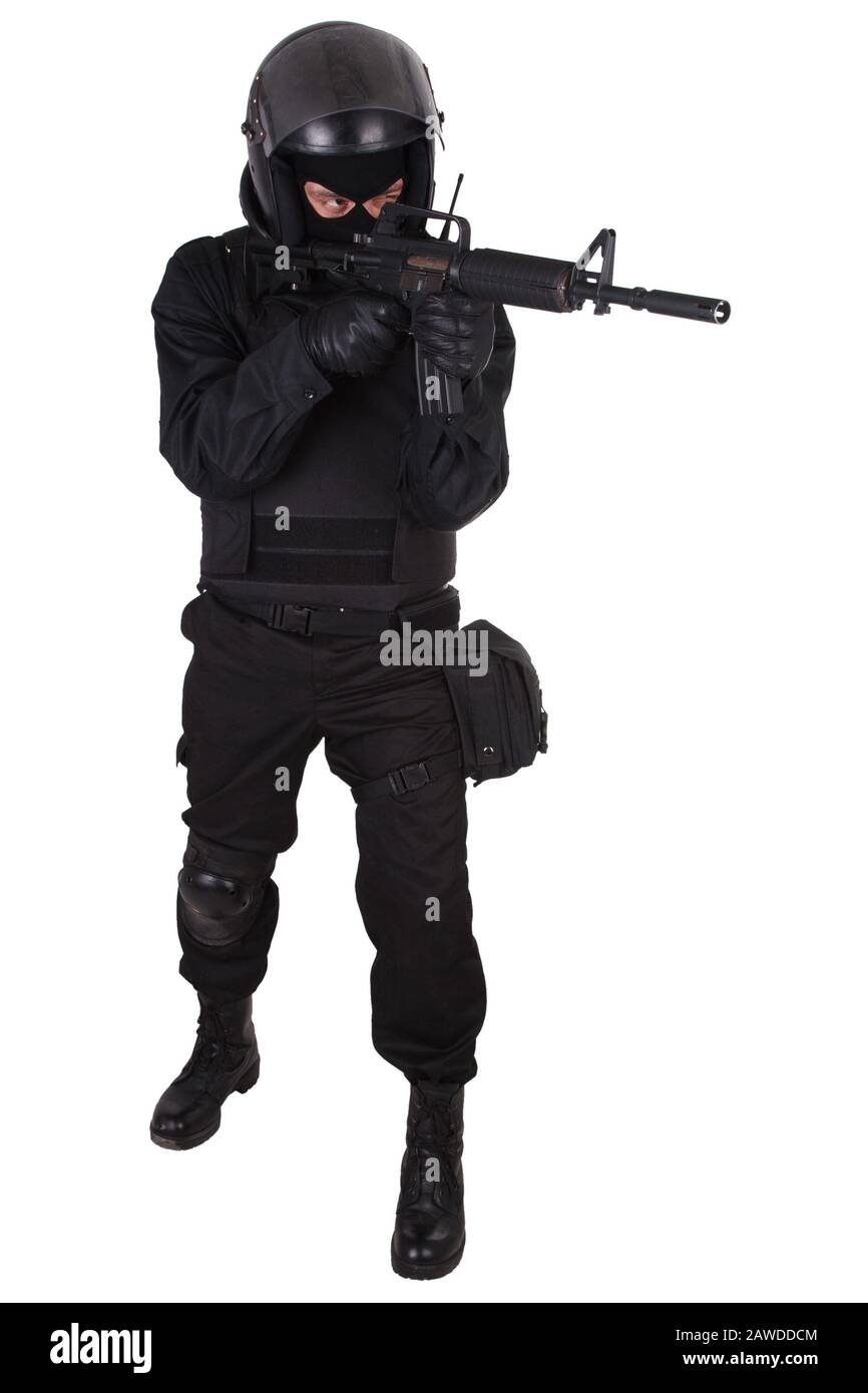 Riot police officer in black uniform with assault rifle isolated on ...