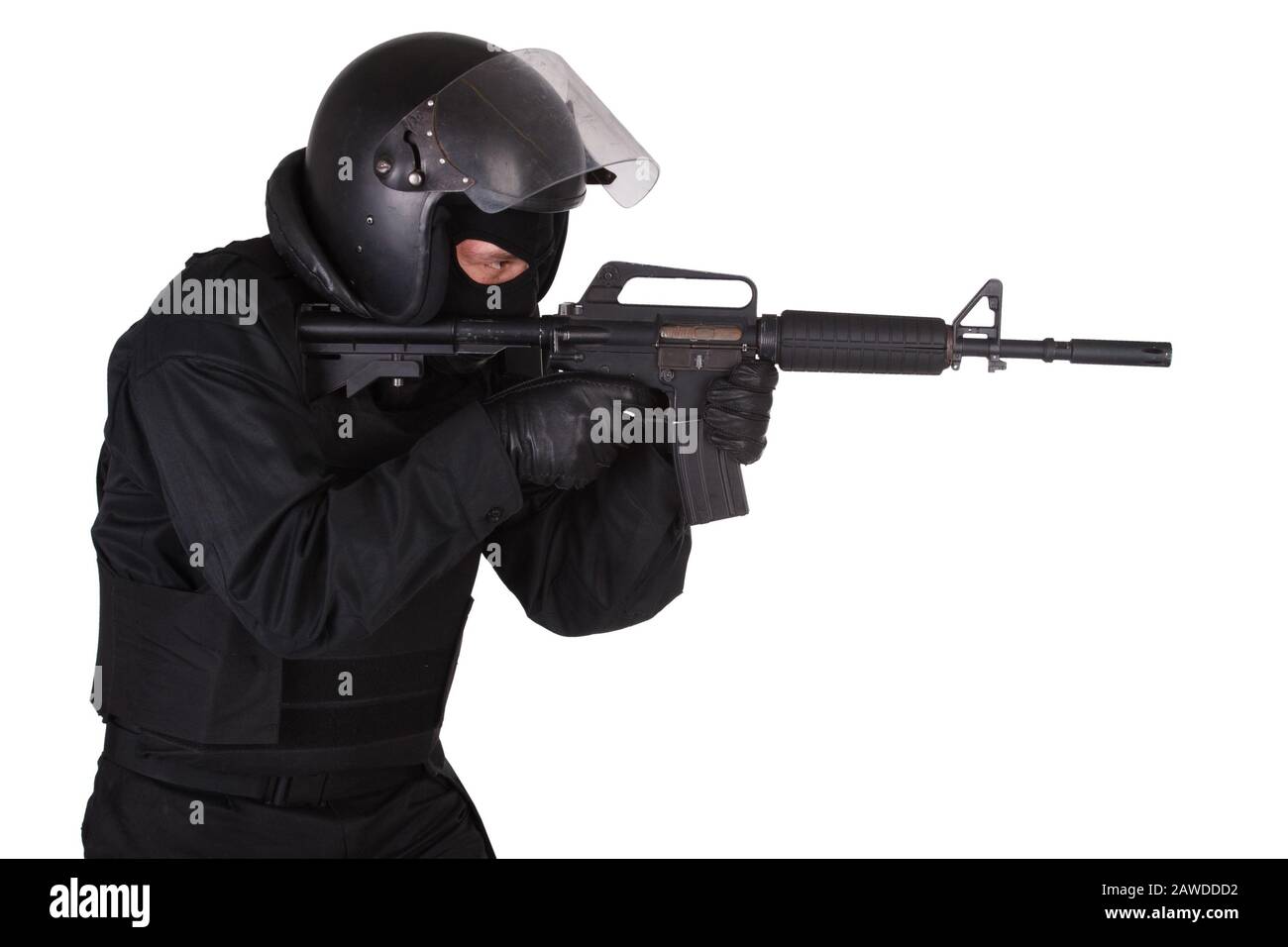 Riot police officer in black uniform with assault rifle isolated on ...