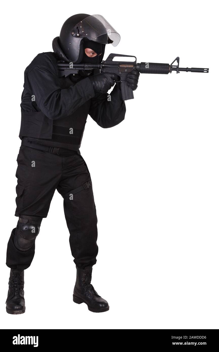 Riot police officer in black uniform with assault rifle isolated on ...