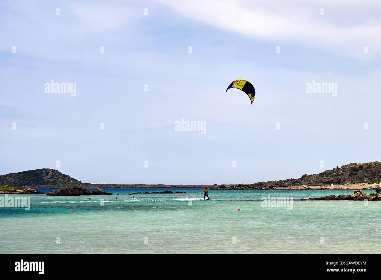 CRETE, GREECE - MAY 19, 2019: tourists enjoy kite on amazing Elafonissi ...