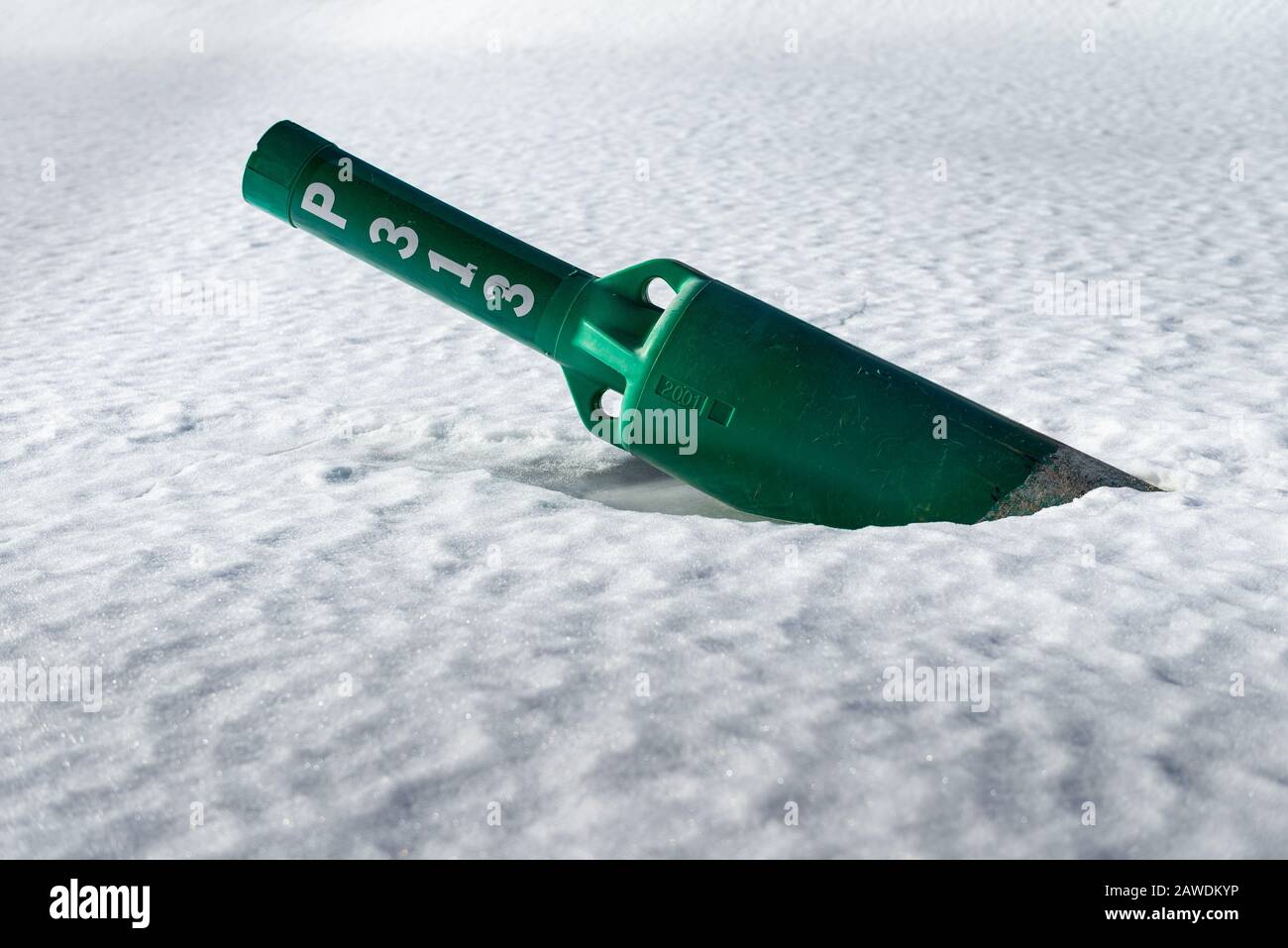 Port hand buoy frozen in a river laying on its side, non navigable due ...
