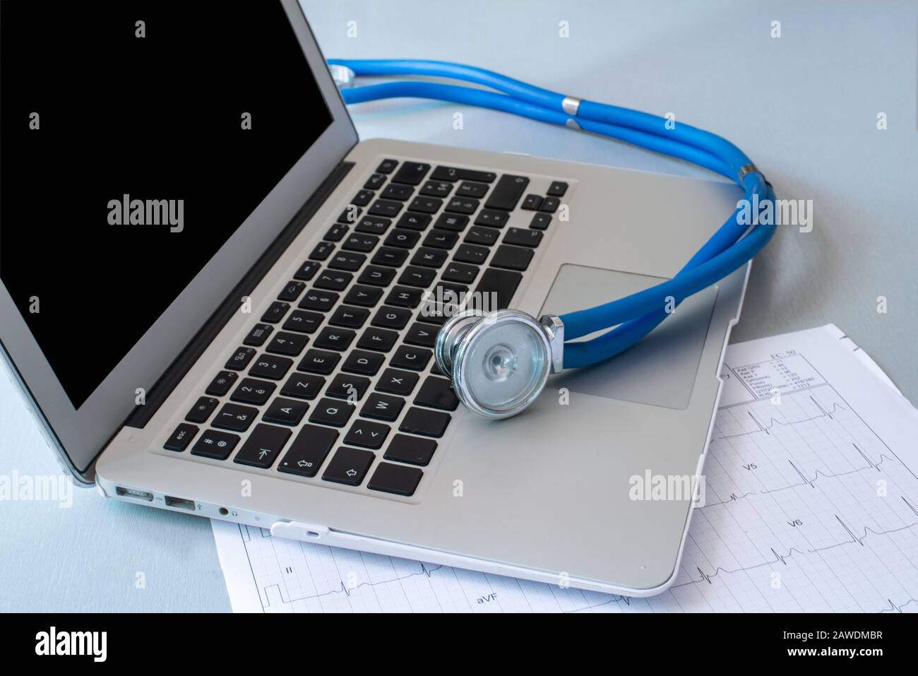 Stethoscope and electrocardiogram with computer with blank screen room ...