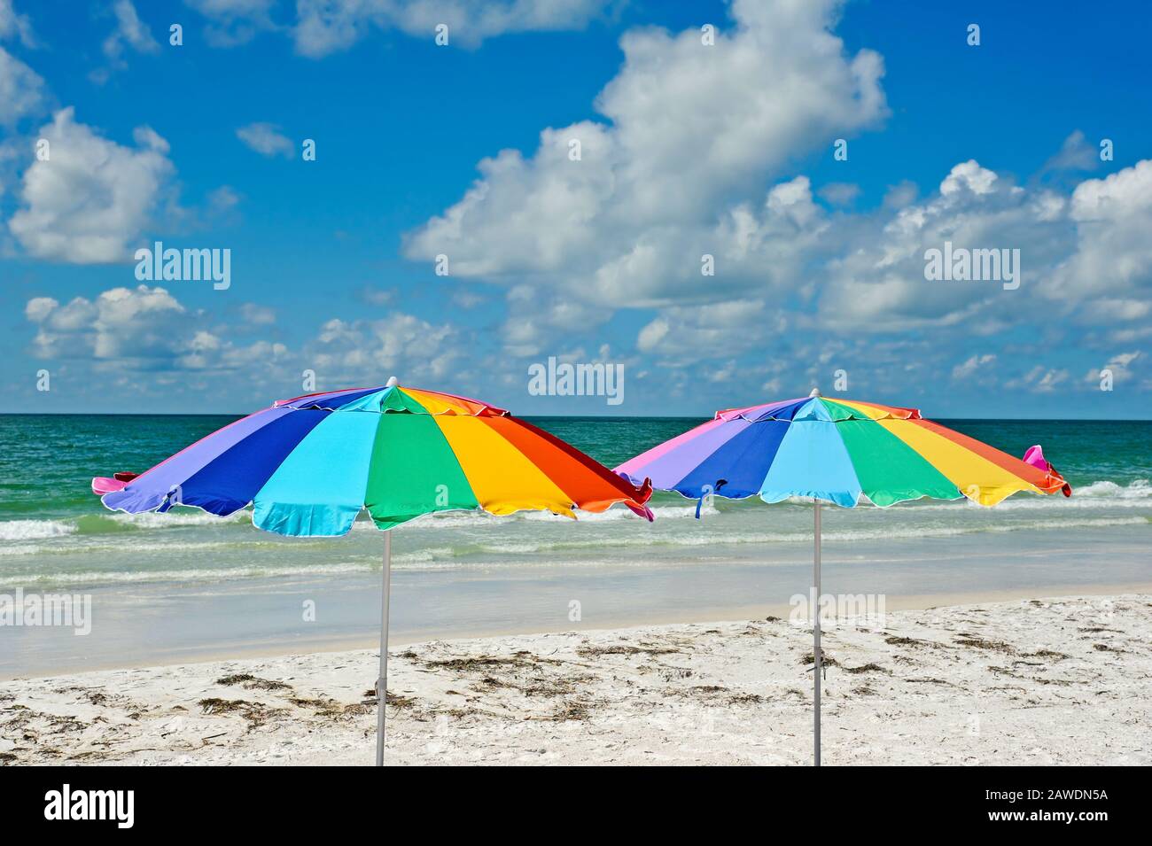 Rainbow colored beach umbrellas hi-res stock photography and images - Alamy