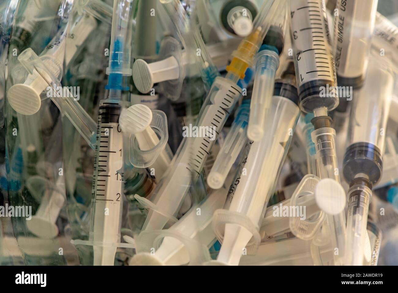 Used syringes with needles vaccine medical trash Stock Photo - Alamy