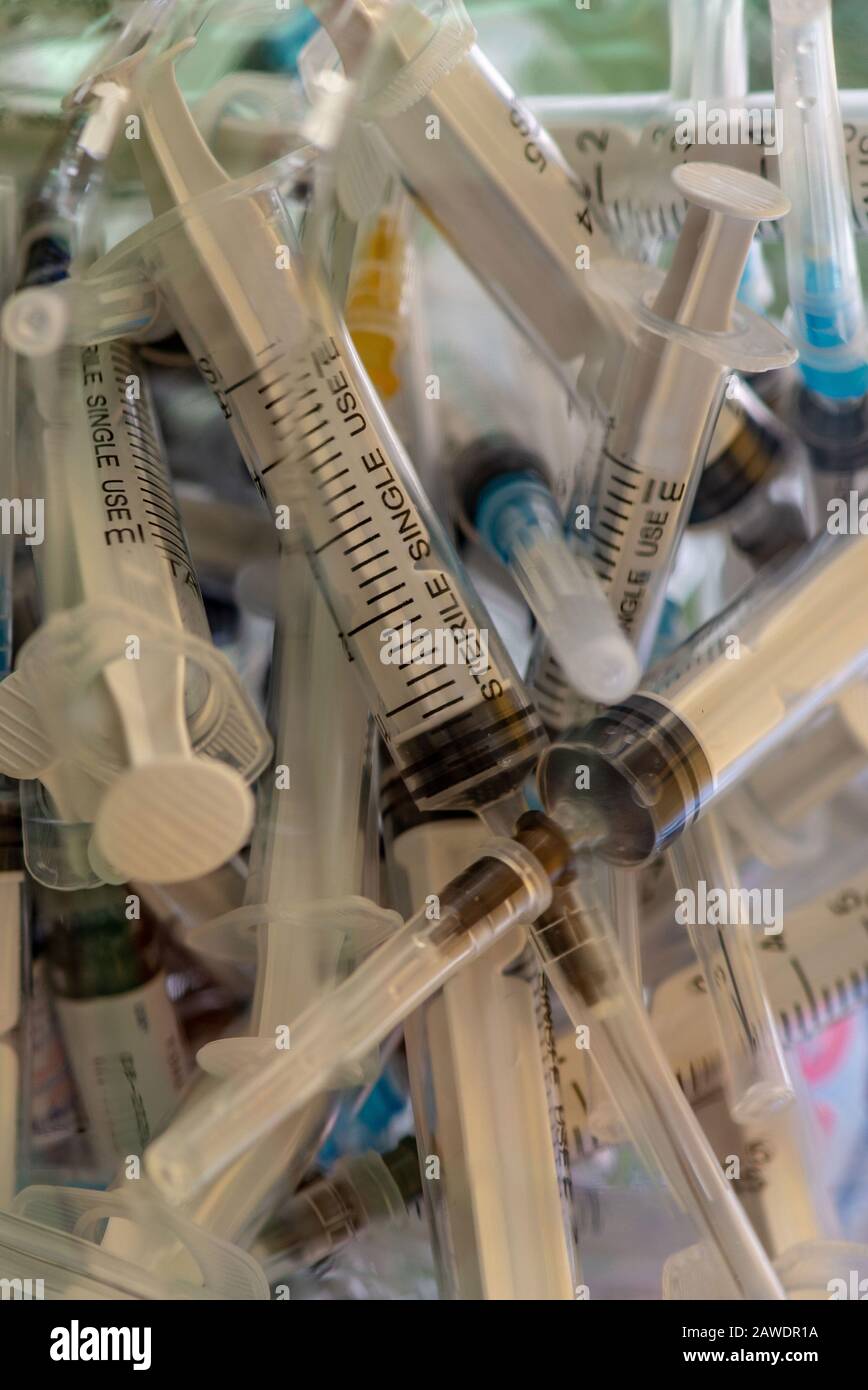 Used syringes with needles vaccine medical trash Stock Photo - Alamy