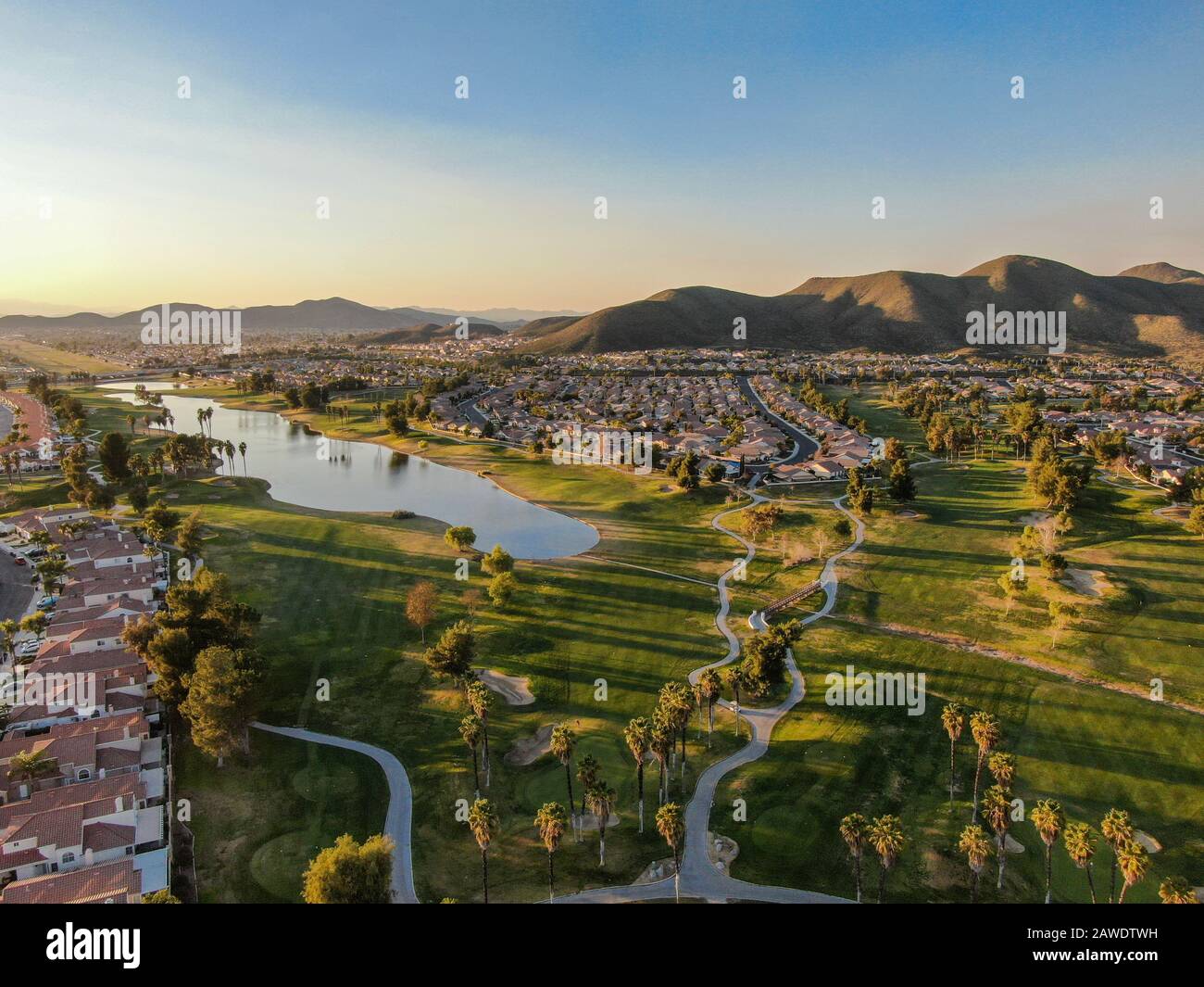 Aerial view of golf course surrounded by town houses and luxury villas ...