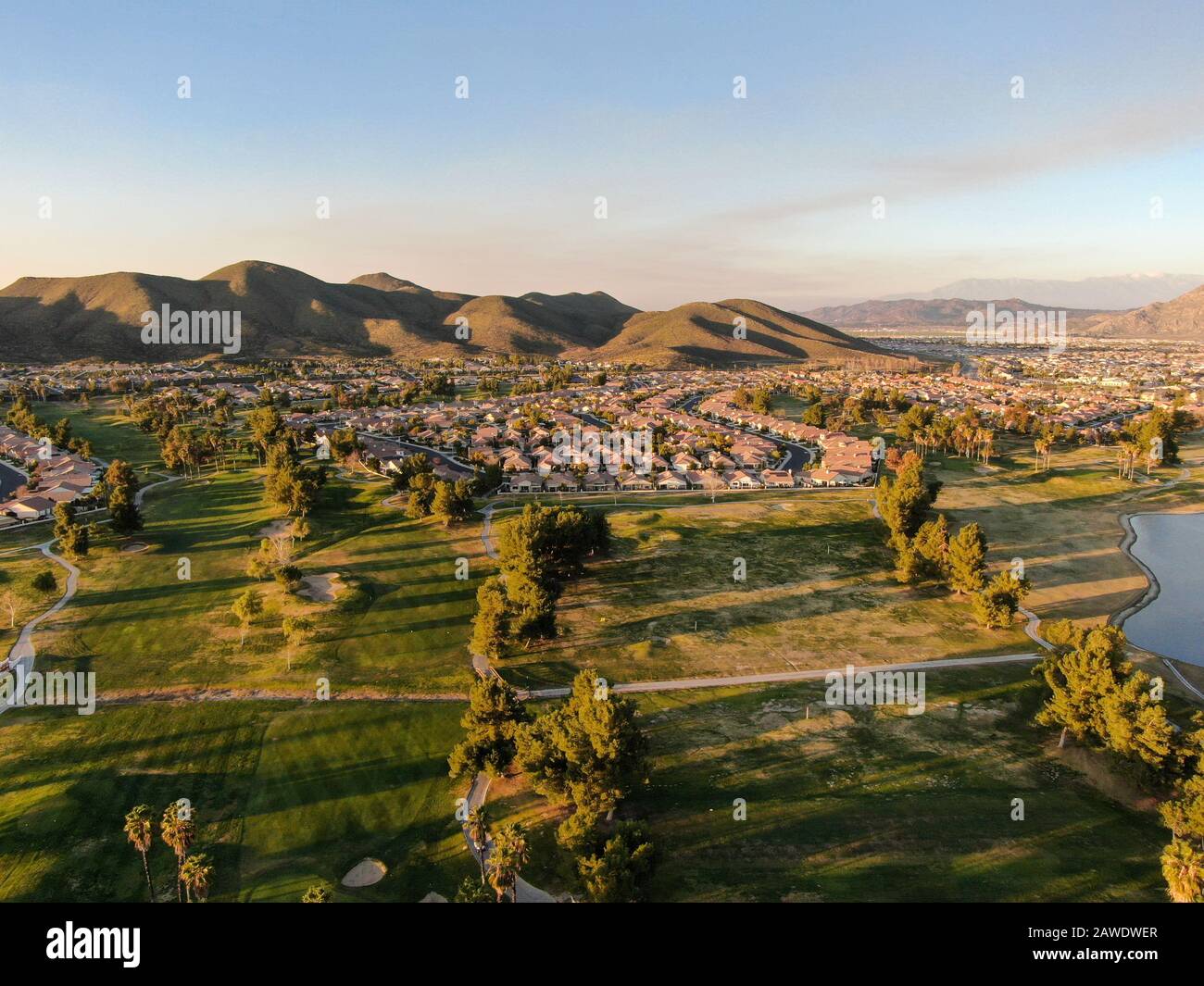 Aerial view of golf course surrounded by town houses and luxury villas ...