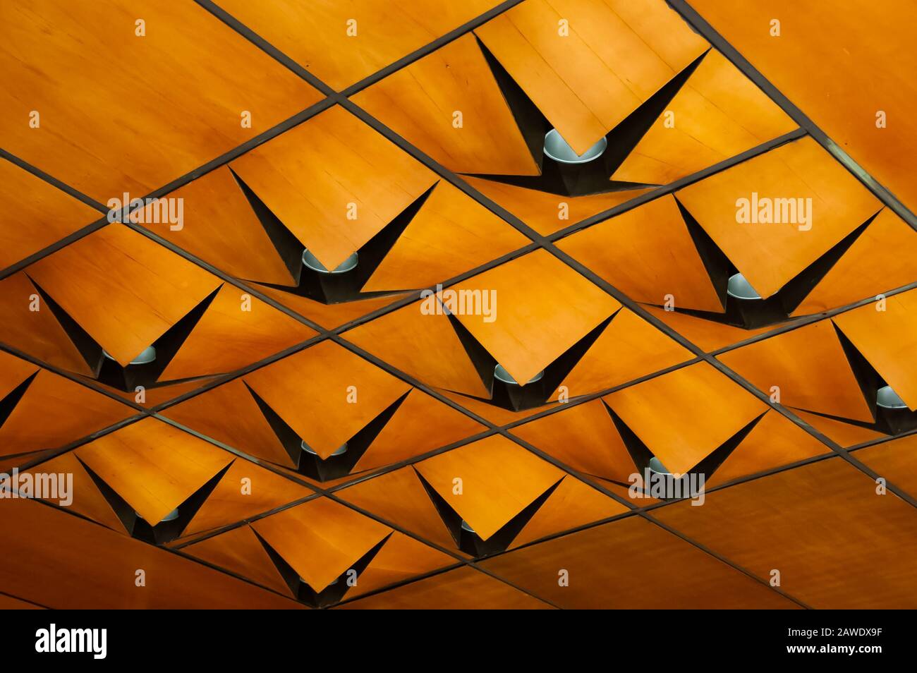 Modern ceiling with interesting pattern of squares in which lamps are ...