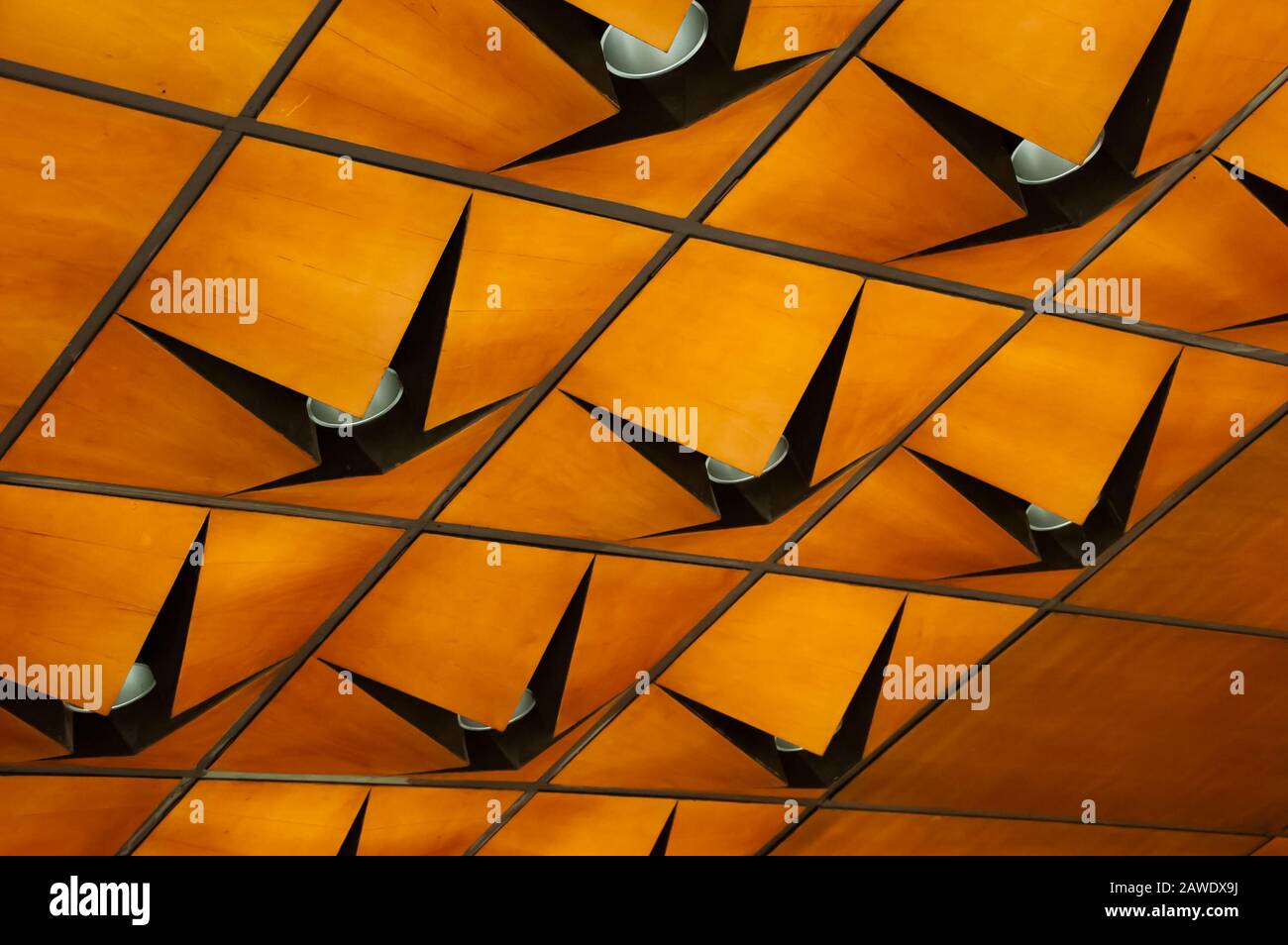 Modern ceiling with interesting pattern of squares in which lamps are ...