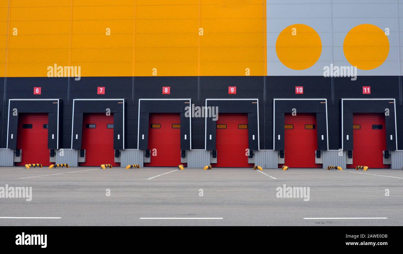 Modern logistic warehouse. A row of loading pads with gates. Industry ...