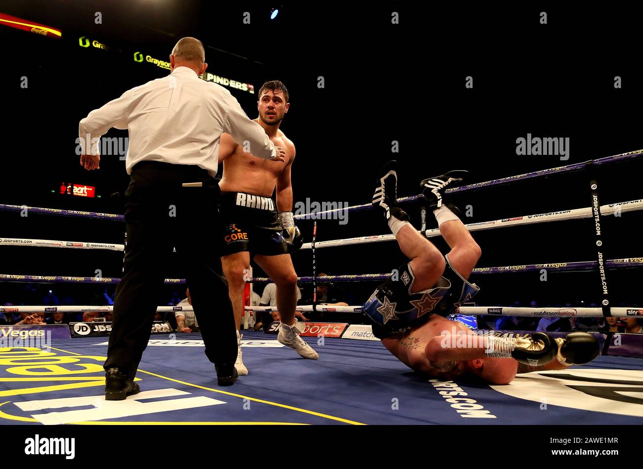 Dave Allen knocks down Dorian Darch in the Heavyweight contest at the ...