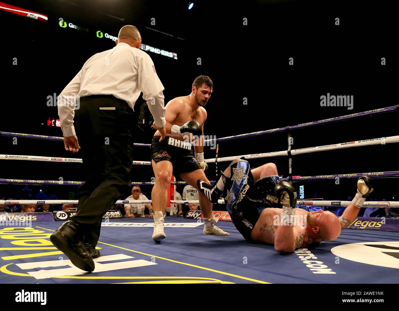 Dave Allen knocks down Dorian Darch in the Heavyweight contest at the ...