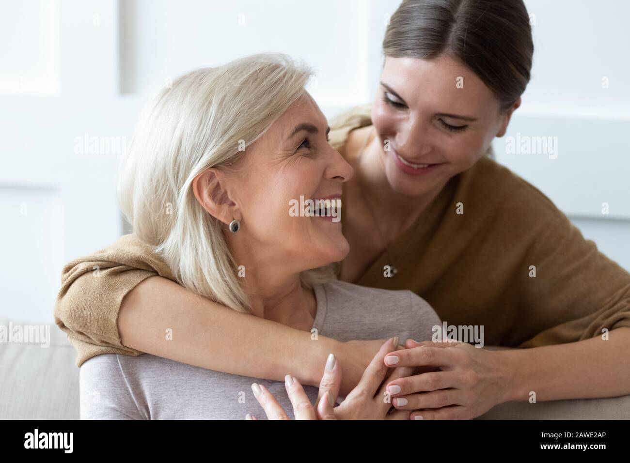 Daughter hugging senior hi-res stock photography and images - Alamy