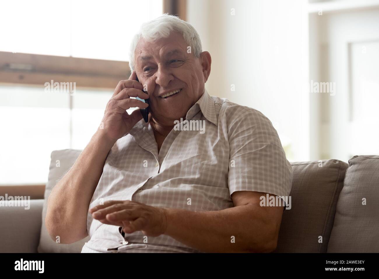 Happy elderly man talk using modern smartphone gadget Stock Photo - Alamy