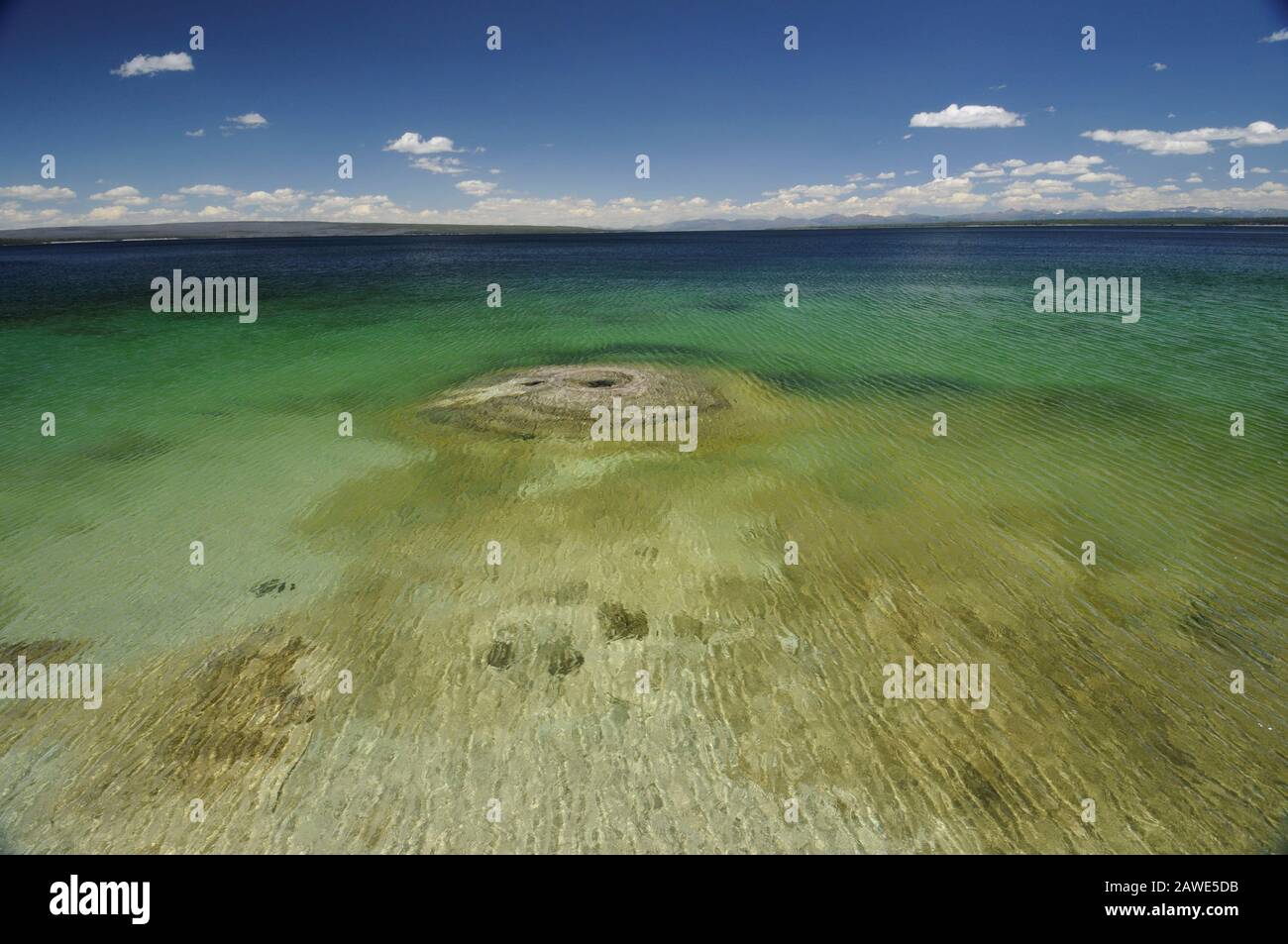 An underwater hot spring near the shore of Yellowstone Lake on a bright ...