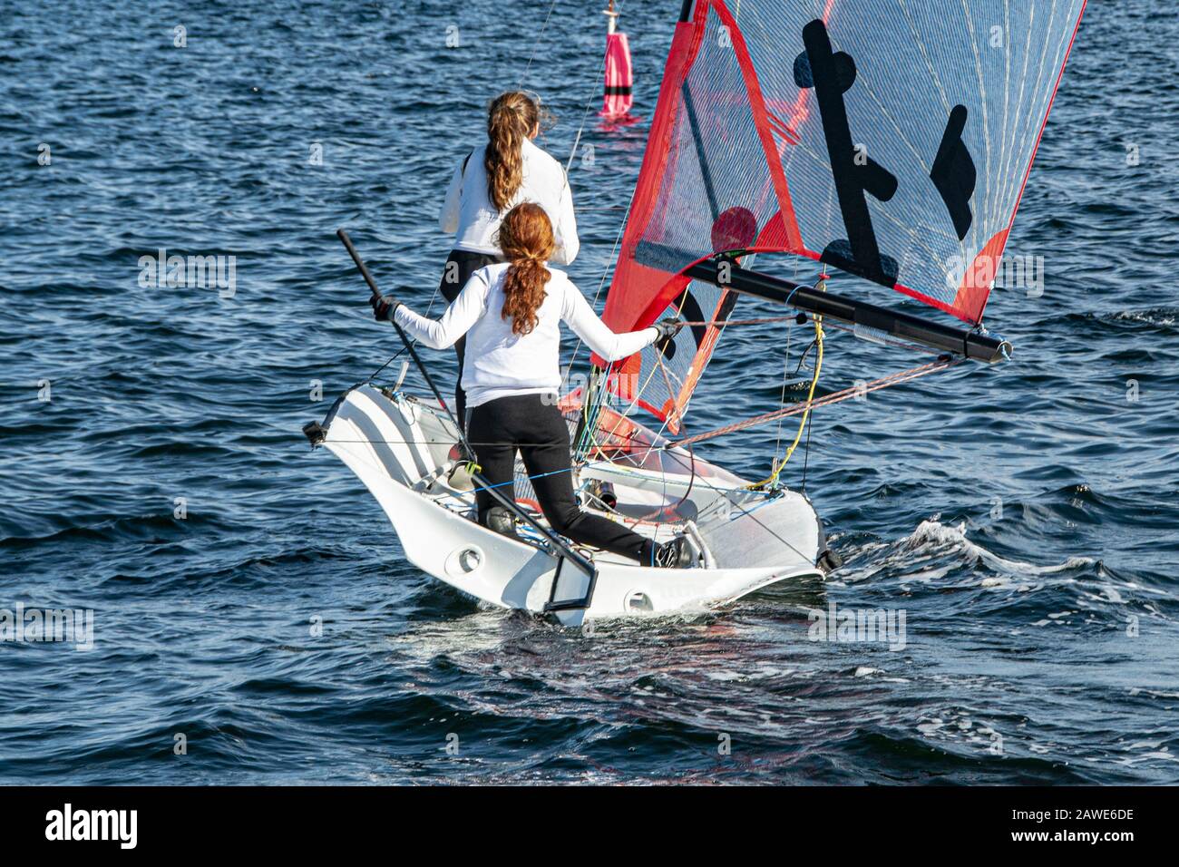 Two girls sailing small boat hi-res stock photography and images - Alamy