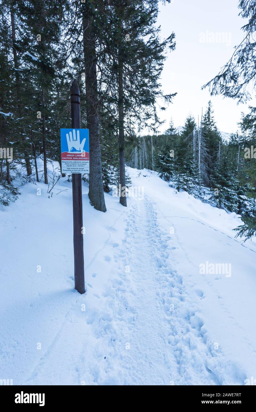 Avalanche warning sign saying Danger of Avalanches Stock Photo - Alamy
