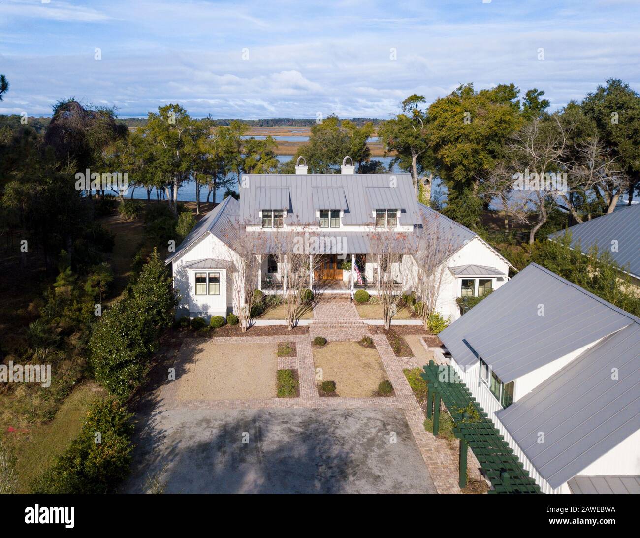 Low aerial view of beautiful, large, waterfront property on river Stock ...