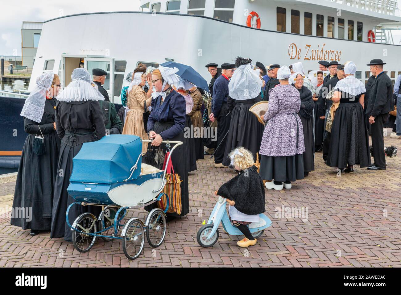 People with traditional clothing and headgear at Dutch local fair Stock ...