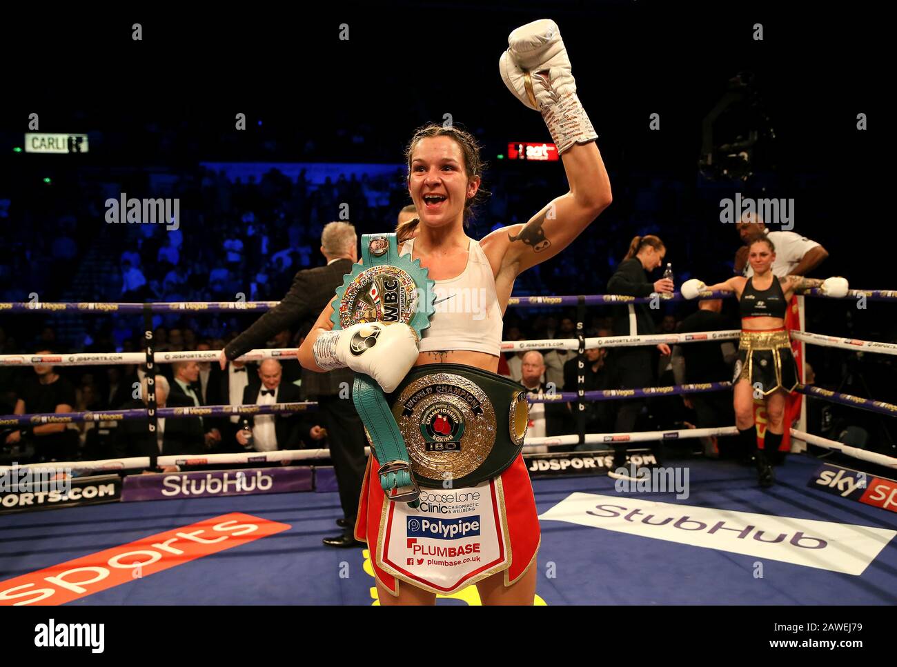 Terri Harper celebrates victory with her belts after beating Eva ...