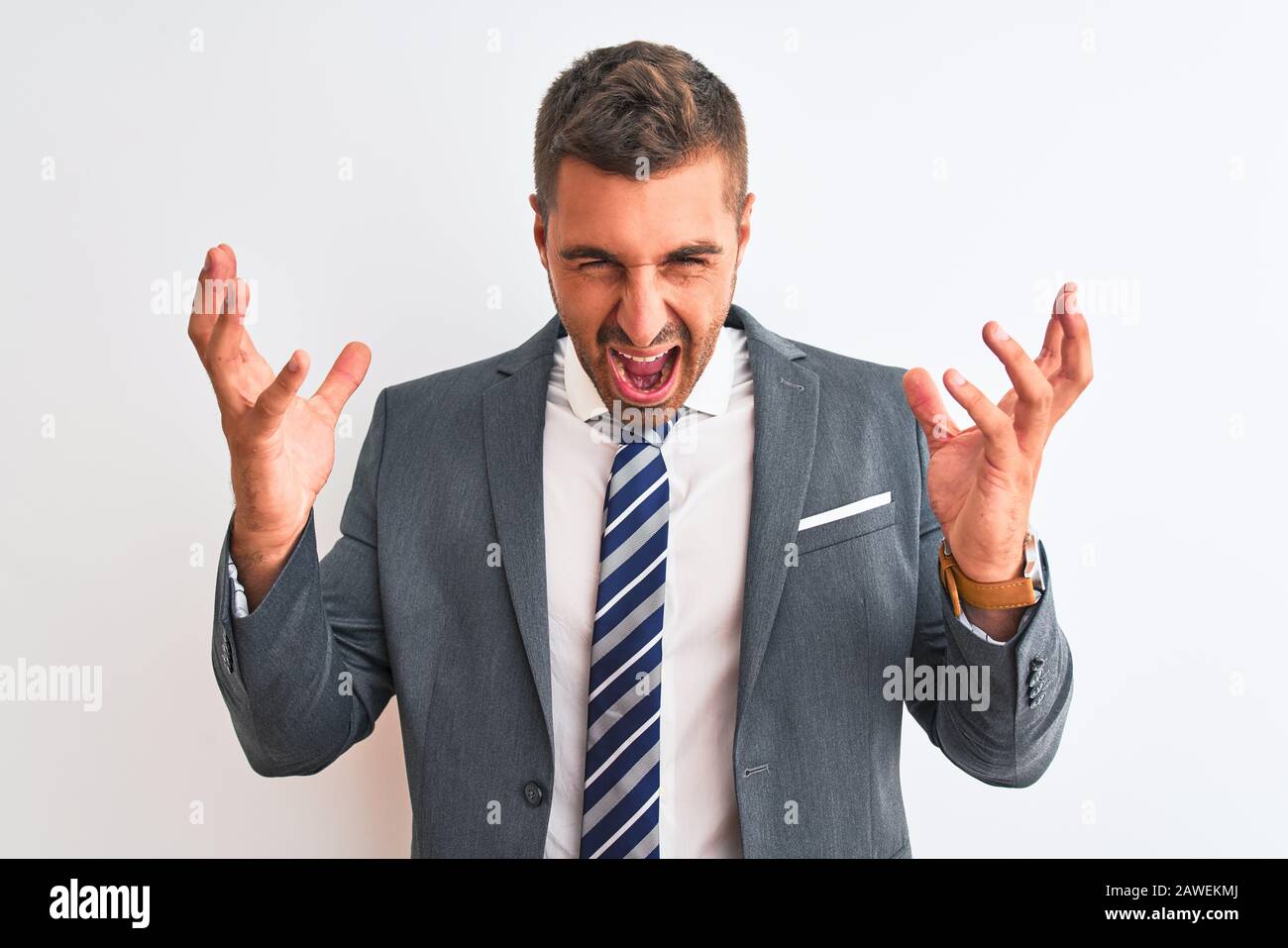 Young handsome business man wearing suit and tie over isolated ...
