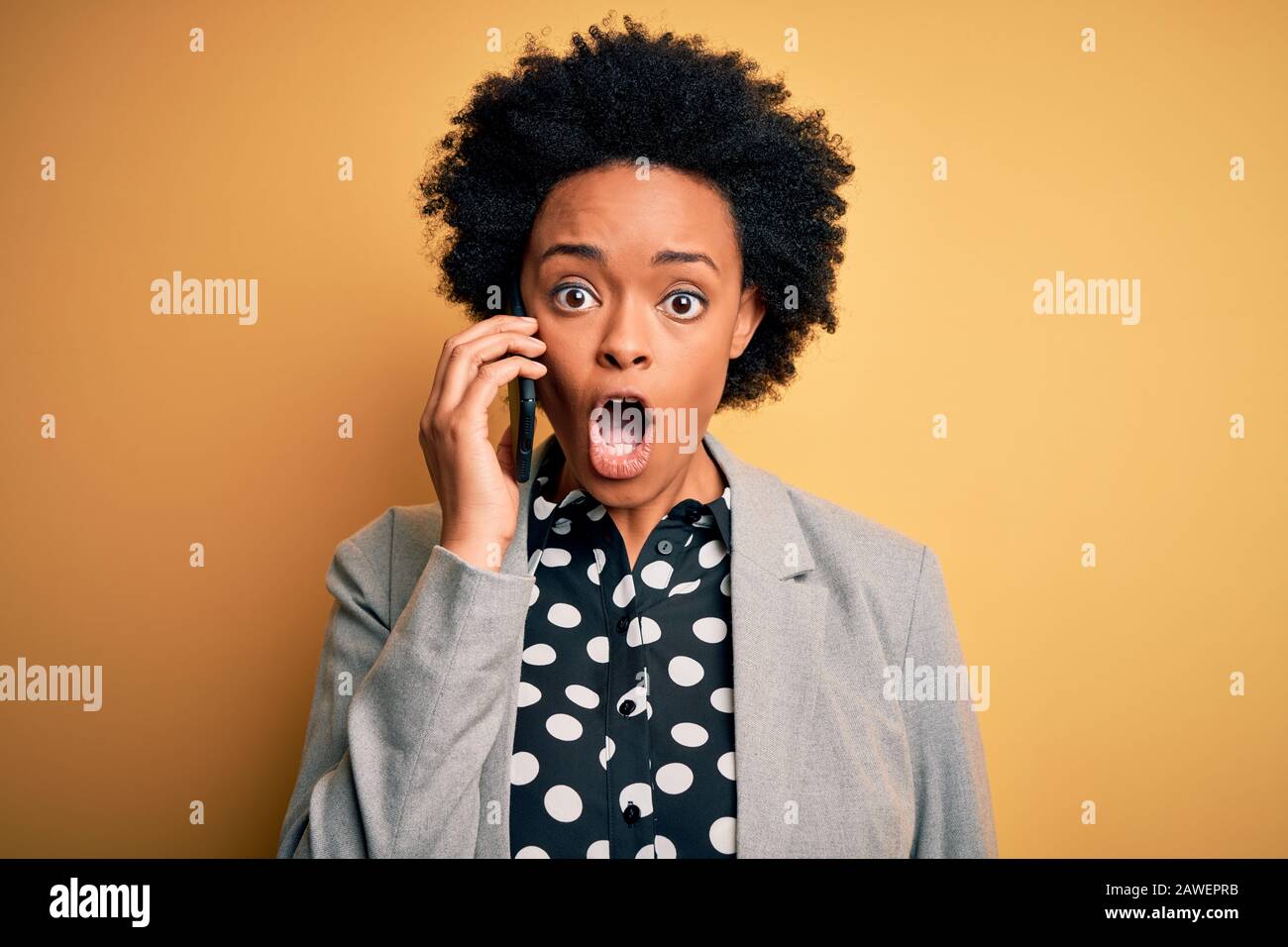 Young African American afro woman with curly hair having conversation ...