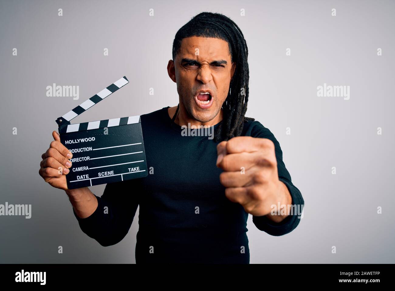 Young african american afro director man making movie using clapboard ...