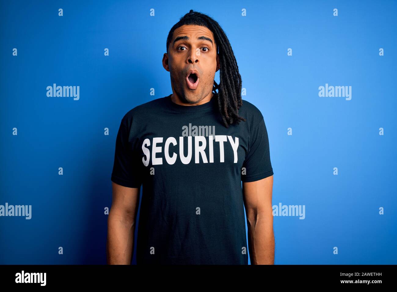 Young african american afro safeguard man with dreadlocks wearing ...
