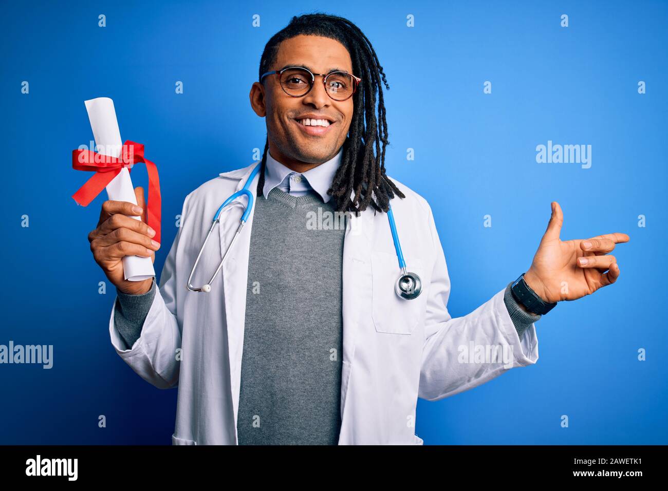 African american doctor man with dreadlocks wearing stethoscope holding ...
