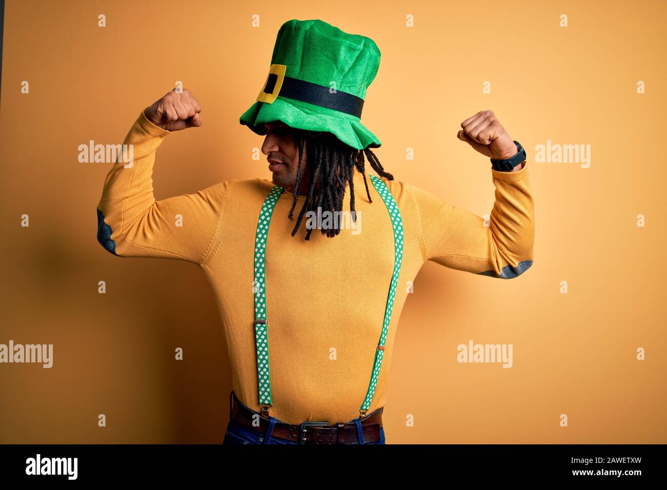 Young african american man wearing green hat celebrating saint patricks ...