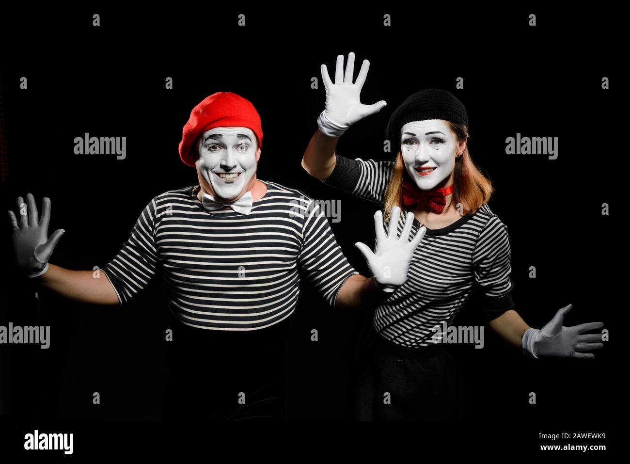 Two mimes touching invisible wall. Smiling faces of artists Stock Photo ...