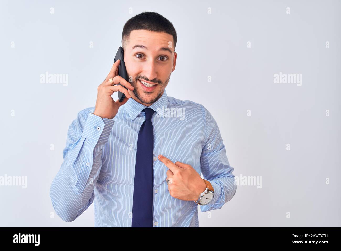 Young handsome business man calling using smartphone over isolated ...