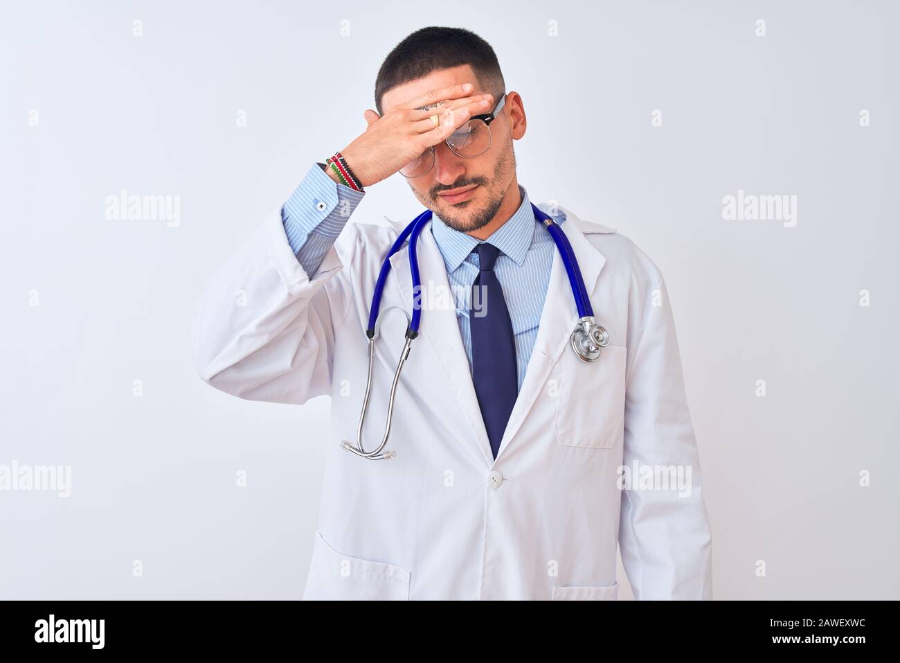 Young doctor man wearing stethoscope over isolated background covering ...