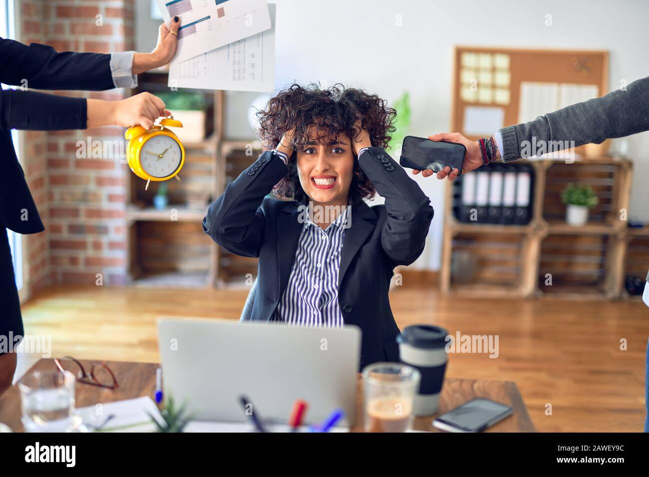 Group of business workers working together. Partners stressing one of ...